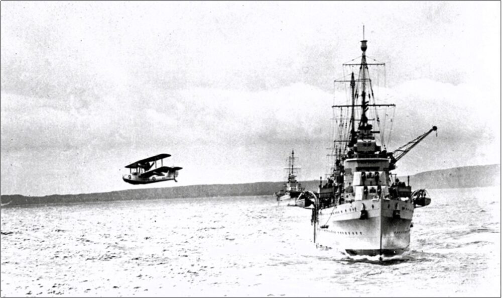 Above HMAS Sydney, leads her sister ship HMAS Hobart during flying ...